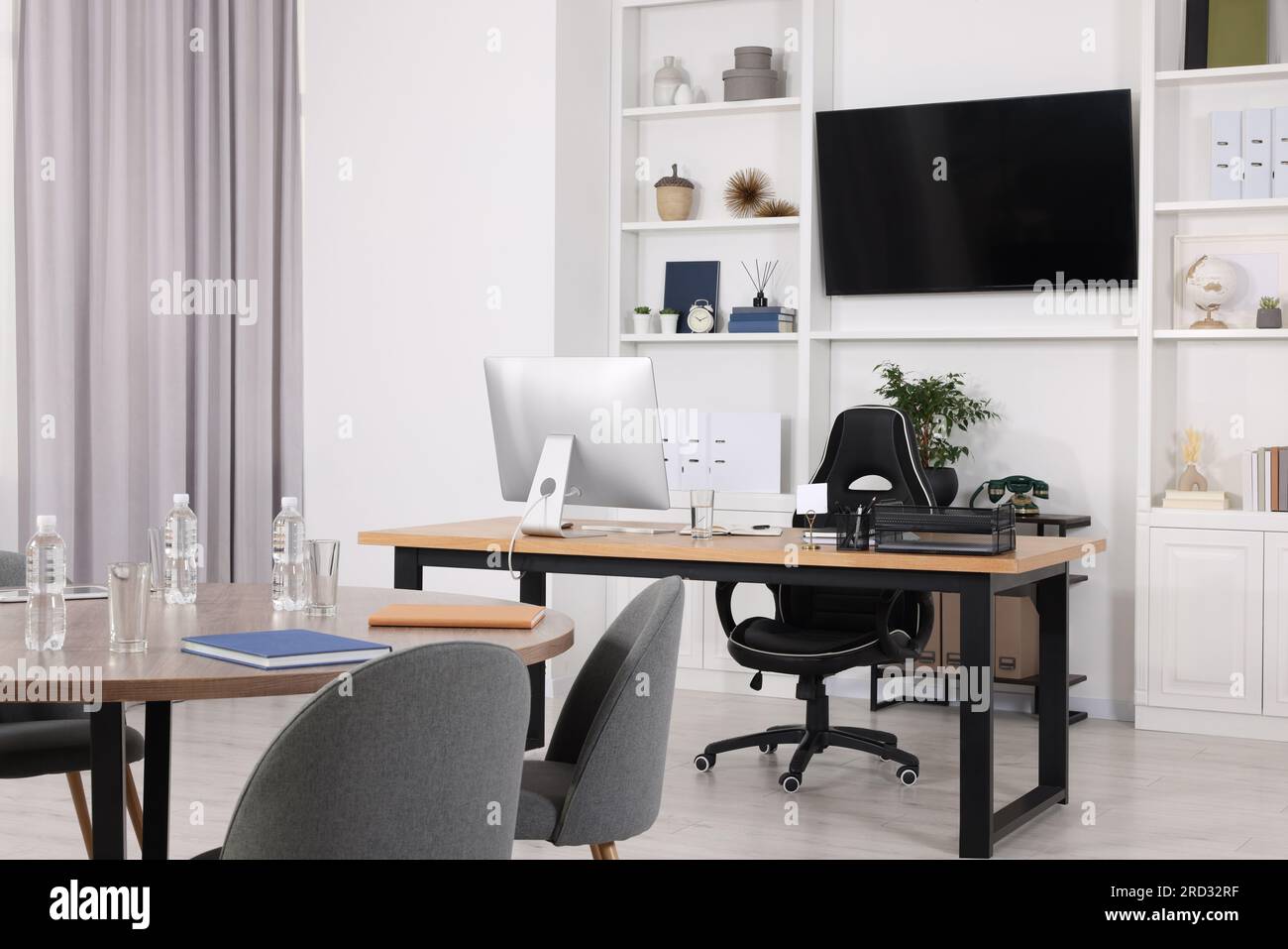 Stylish office with comfortable furniture and tv zone. Interior design ...