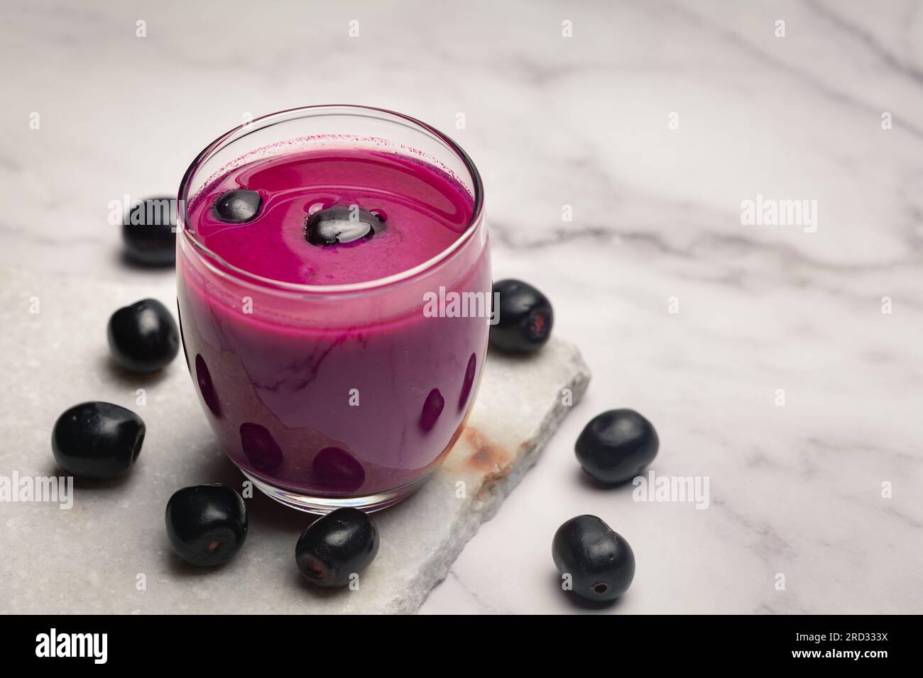 Close-Up of Shake or pulp or juice of Indian Ayurvedic medicinal fresh organic fruit jamun ...