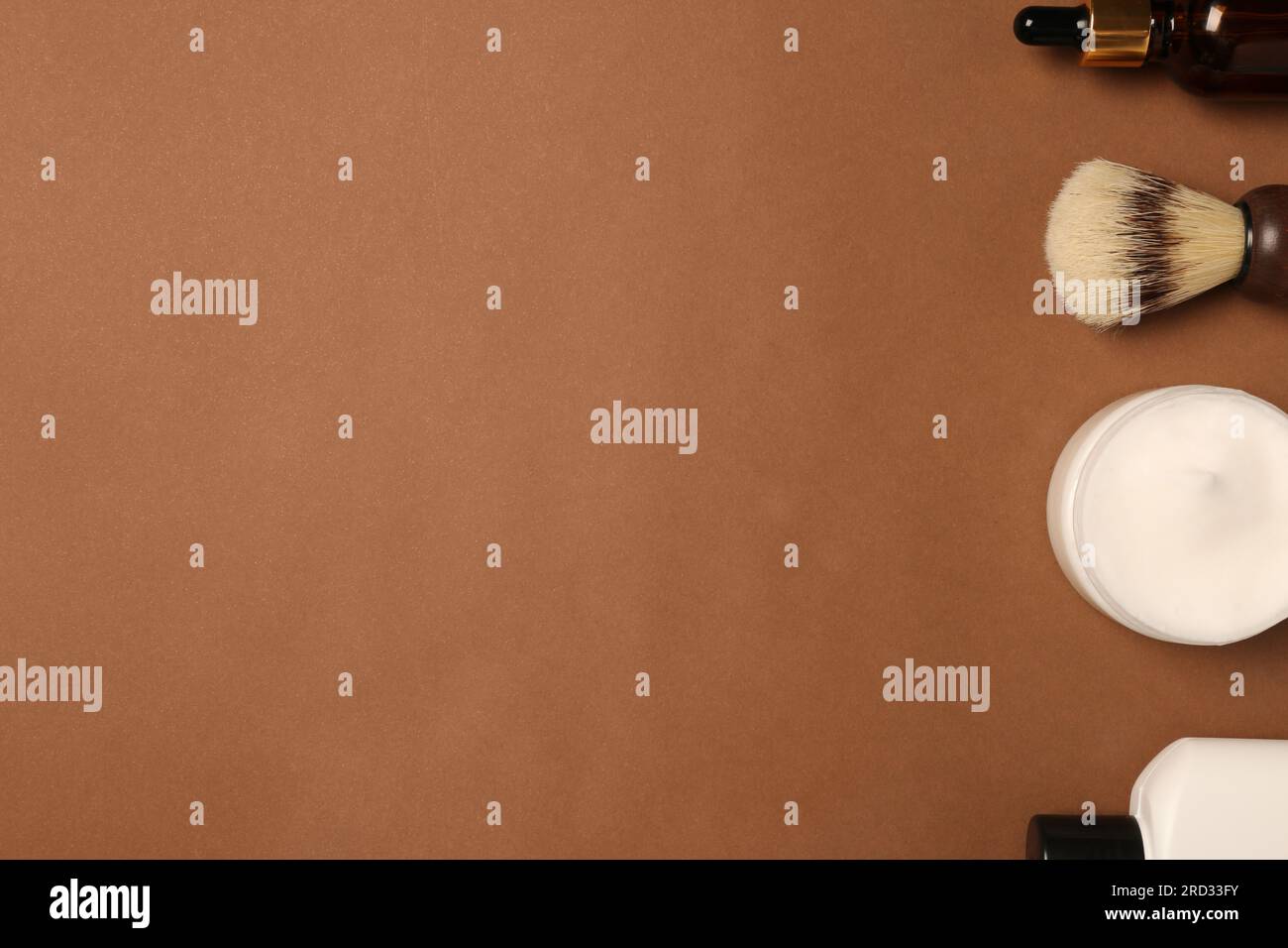 Set of men's shaving tools on brown background, flat lay. Space for ...