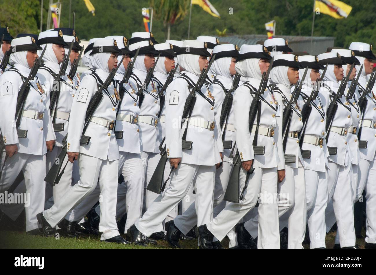 Female officers in dress uniform parade to celebrate their Sultan's ...