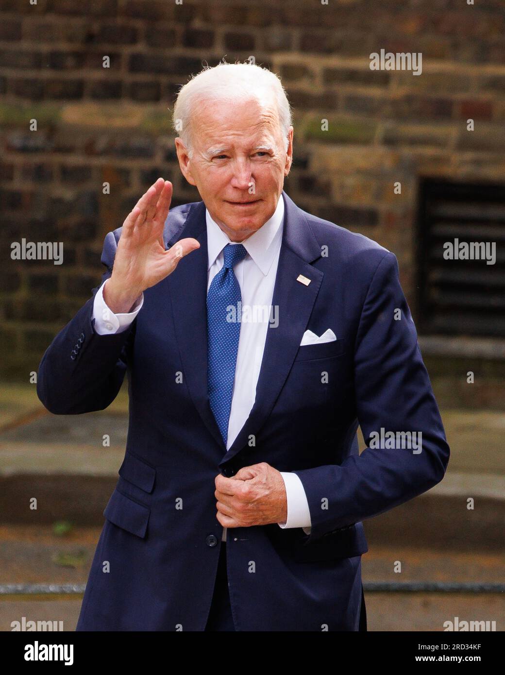 President Joe Biden waves to the media as he gets out of The Beast ...
