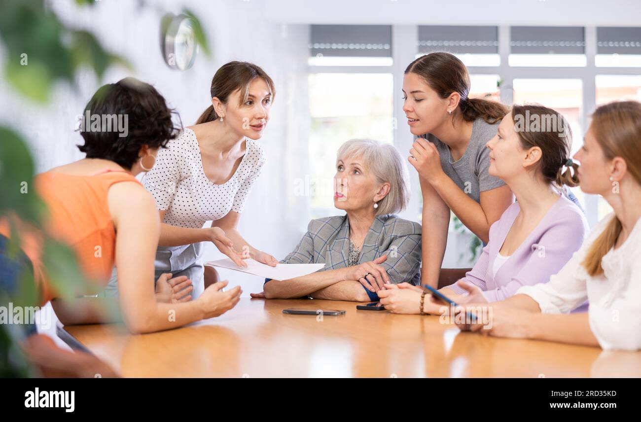 Female students learning course subject together in university ...