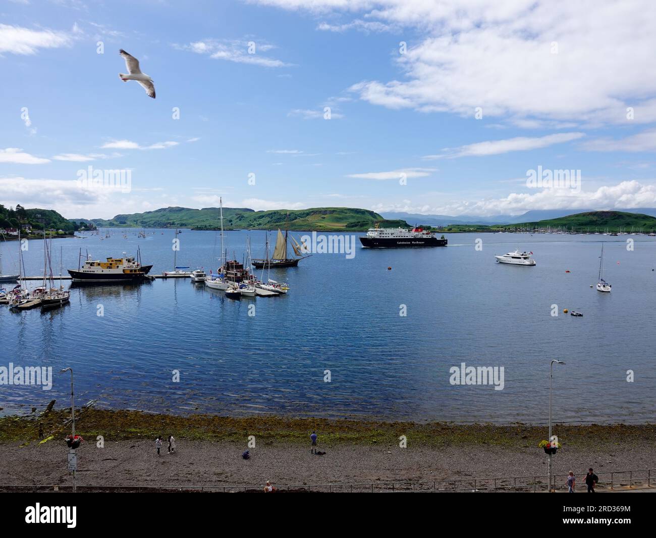 Boat activity in Oban Harbour on a sunny, June day, Inner Hebrides ...