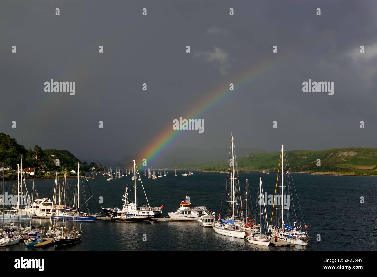 Rainbow backed by storm clouds as weather moves into Oban Bay, harbour ...