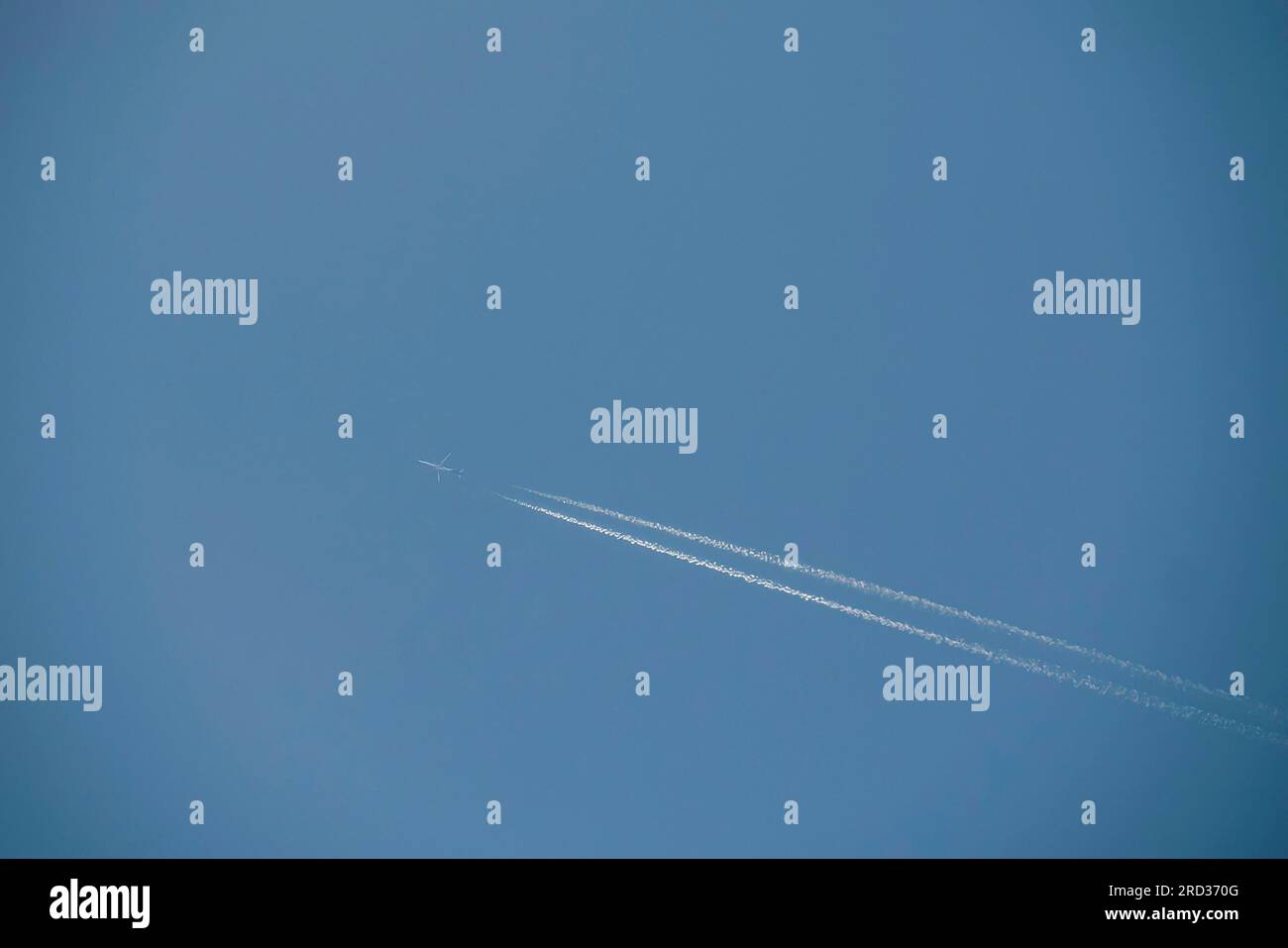 jet tracks in blue sky far Stock Photo - Alamy