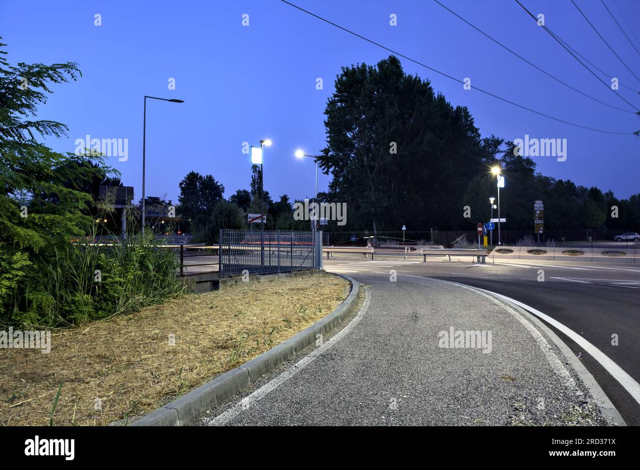 Pedestrian crossing in a road in the italian countryside at night seen ...