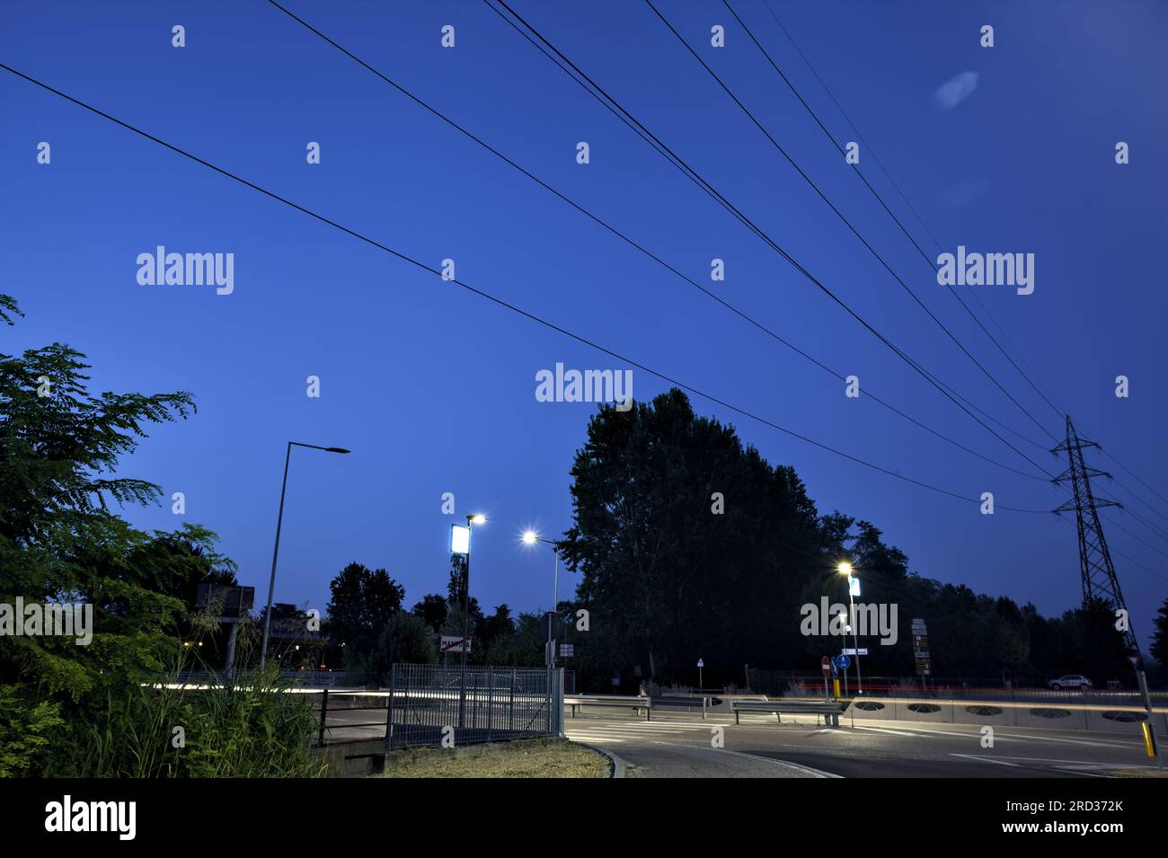 Pedestrian crossing in a road in the italian countryside at night seen ...