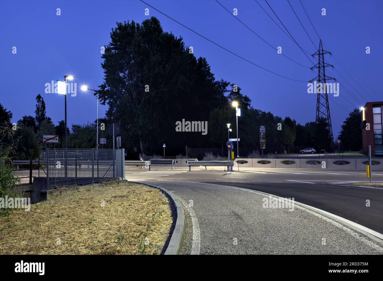 Pedestrian crossing in a road in the italian countryside at night seen ...