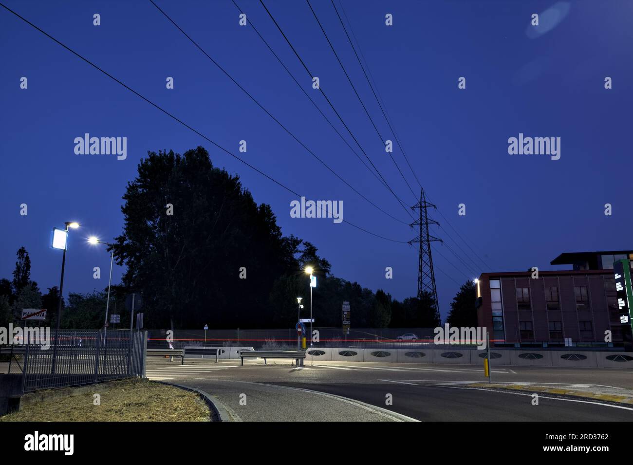 Pedestrian crossing in a road in the italian countryside at night seen ...