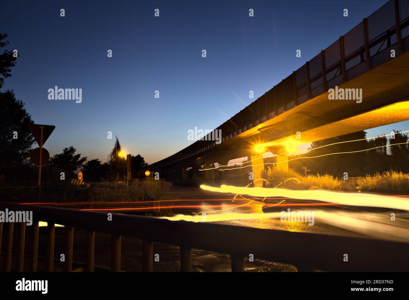 Roundabout under a viaduct in the italian countryside at night seen ...