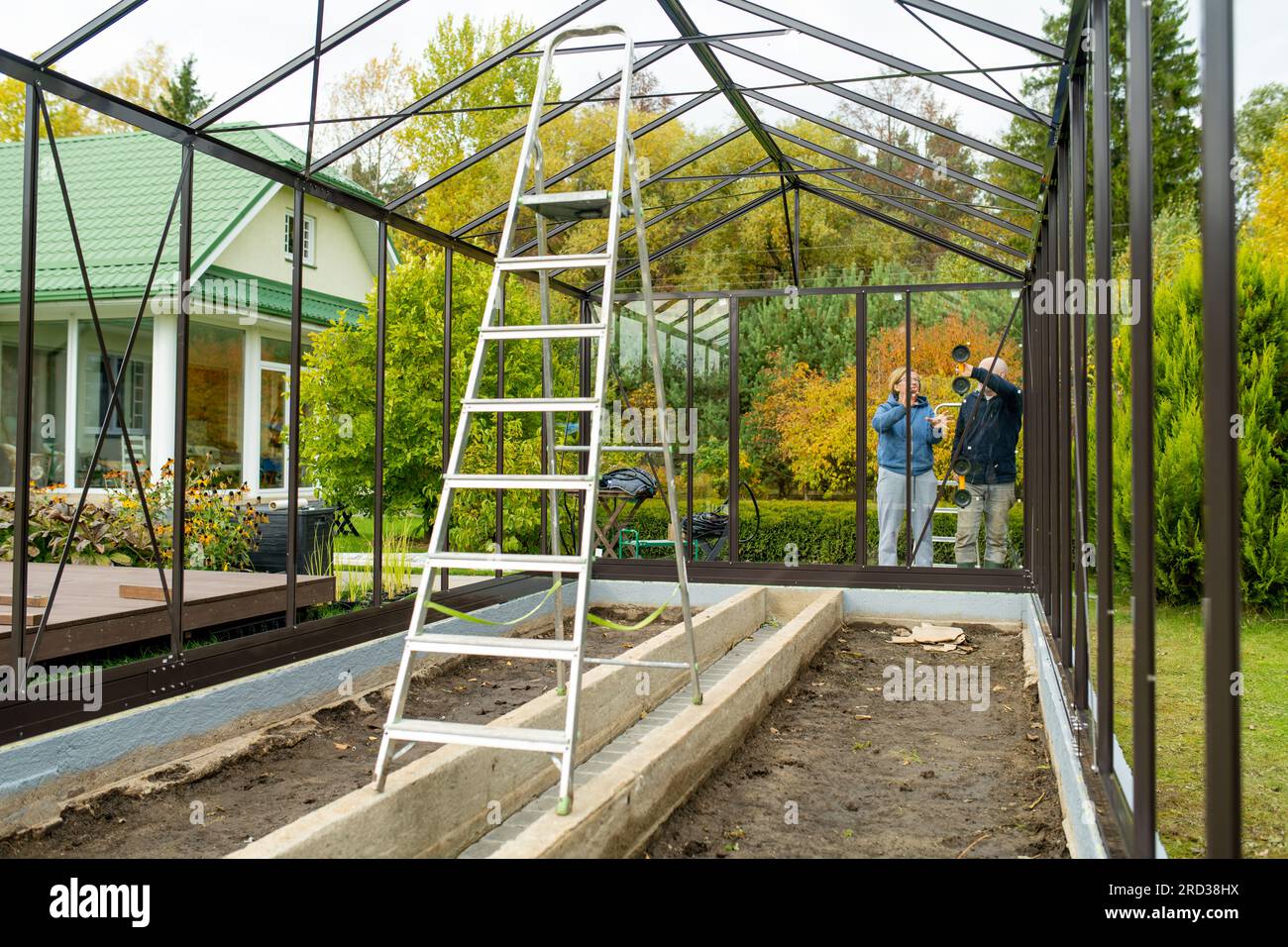 Senior couple working on a project in their garden. Man and woman ...