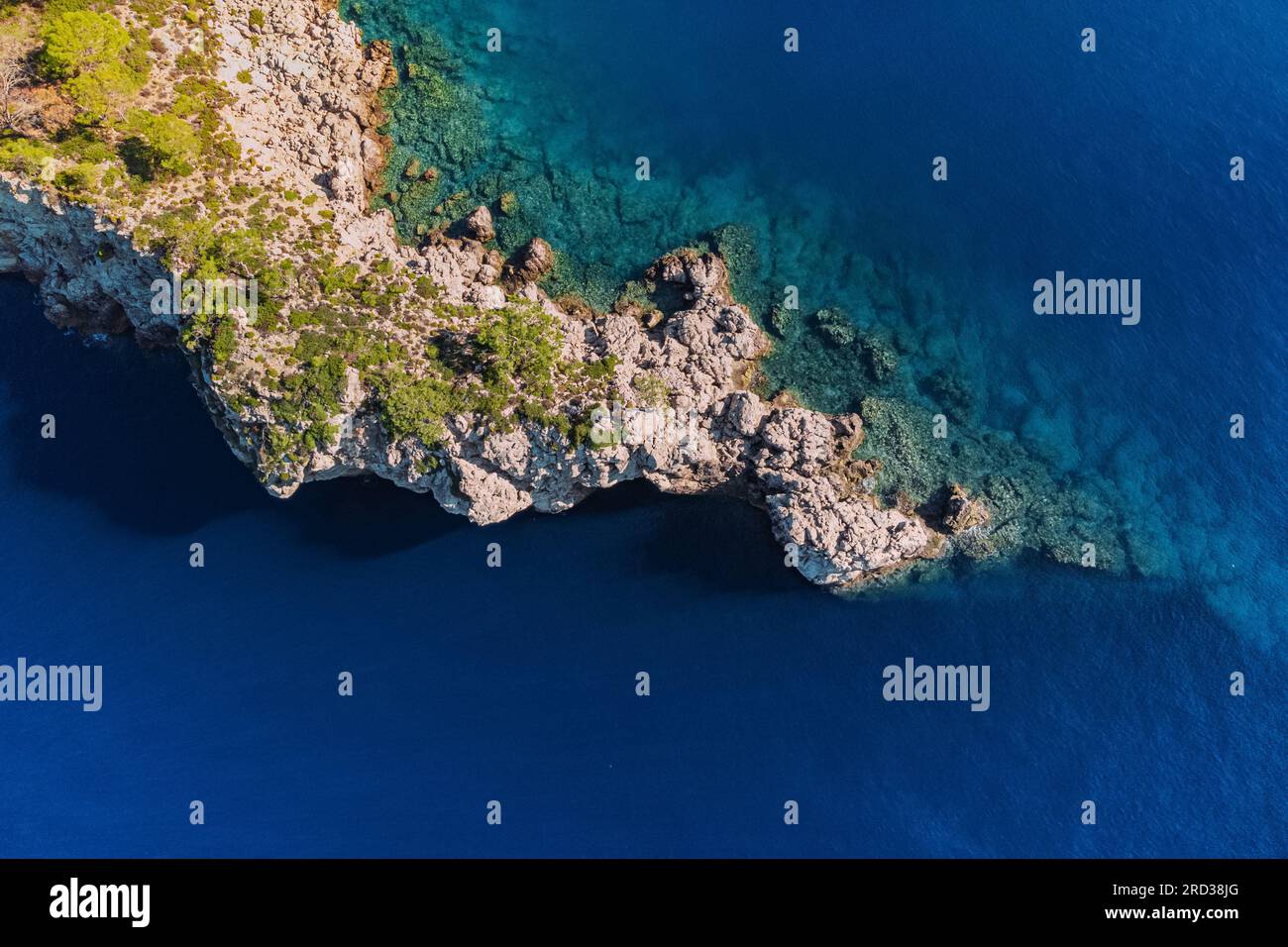 Rocky cliff aerial view. Azure sea or ocean coast. Summer resort and ...