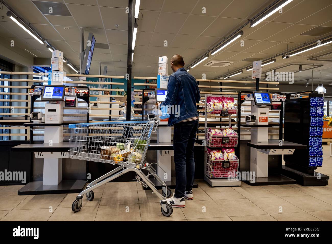 AMSTERDAM - Pay at a self-scan checkout in an Albert Heijn supermarket ...