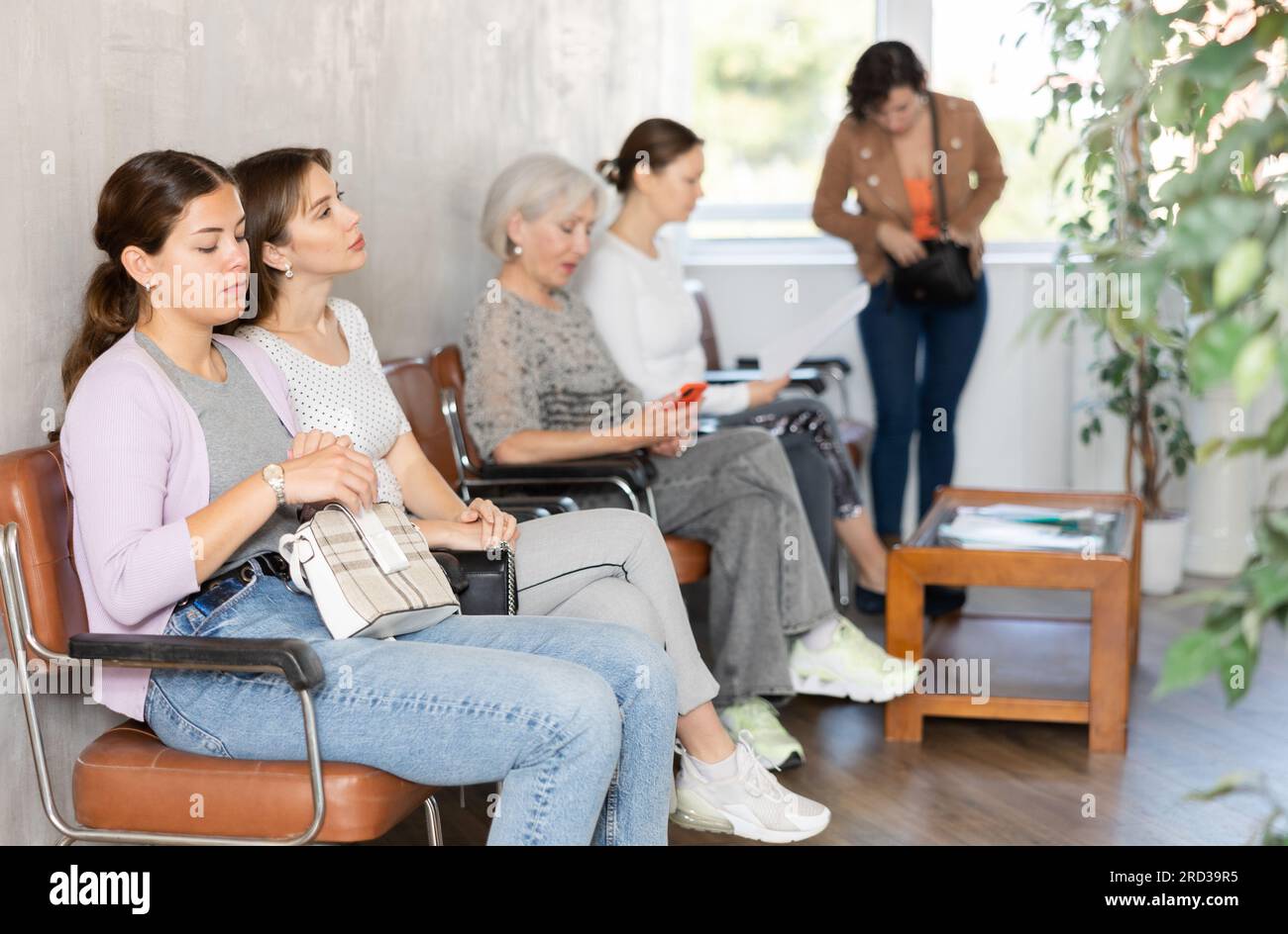 Young girl waiting for interview in lobby of job center Stock Photo - Alamy