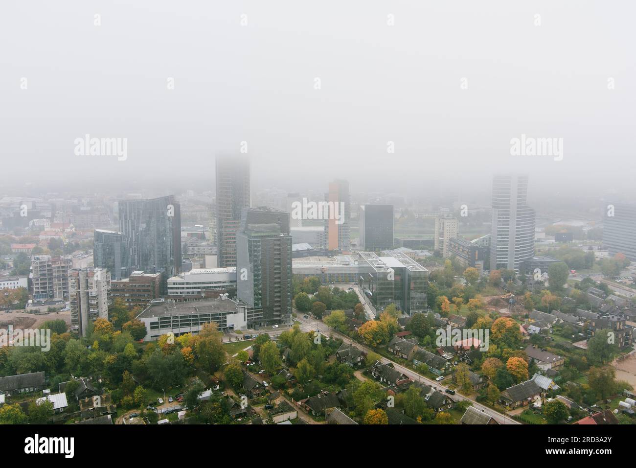 Beautiful foggy Vilnius city scene in autumn with orange and yellow ...
