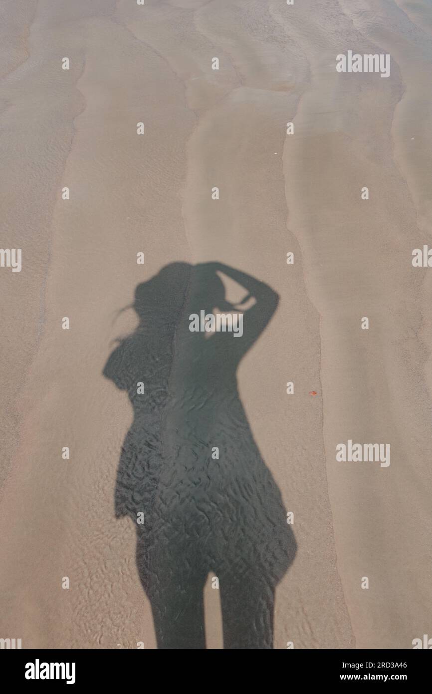 Human shadow on beach hi-res stock photography and images - Alamy