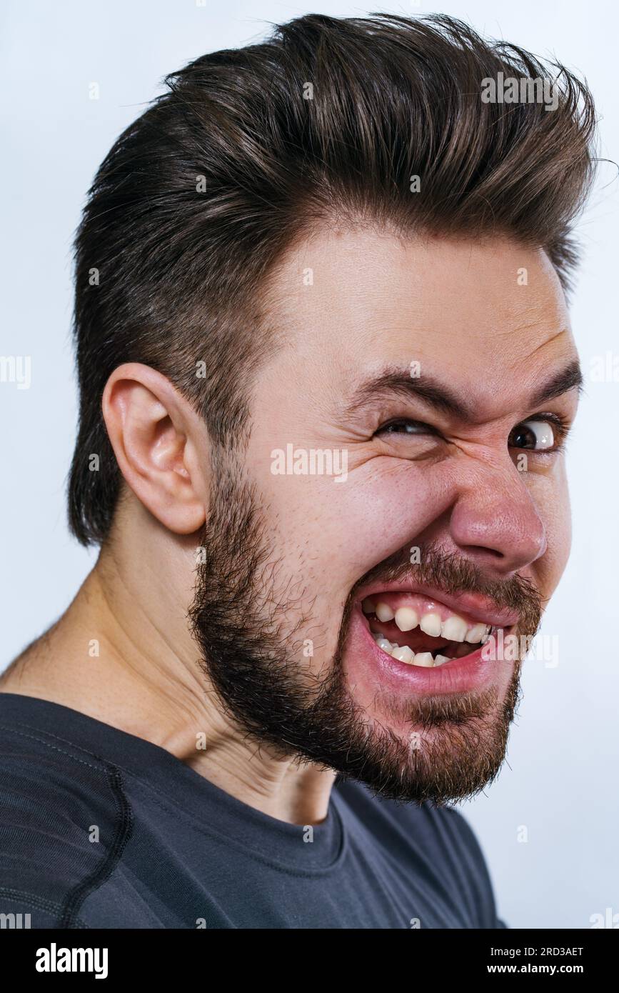 Young crazy danger man emotional portrait on white background Stock ...