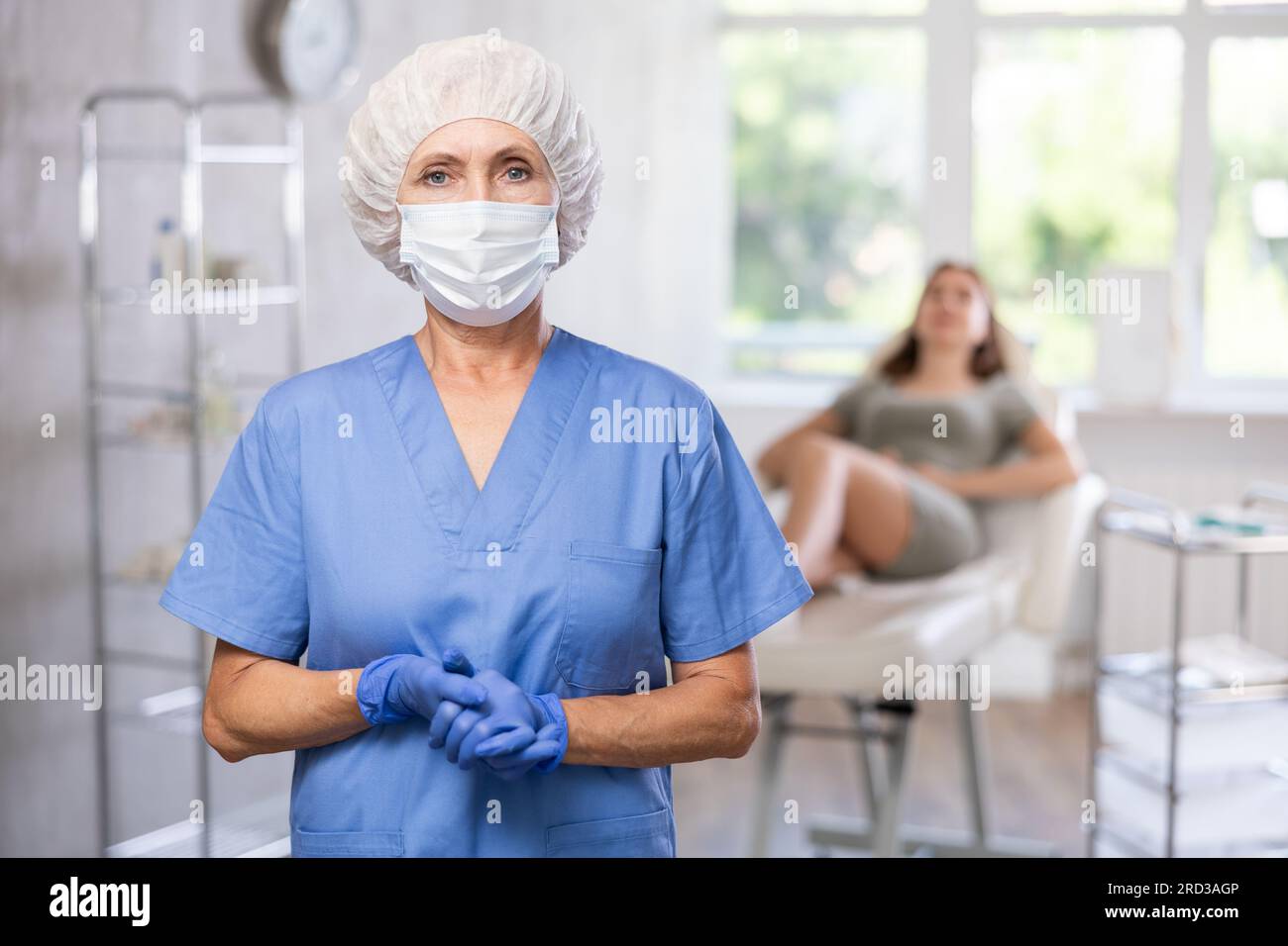 Elderly female doctor with mask Stock Photo - Alamy