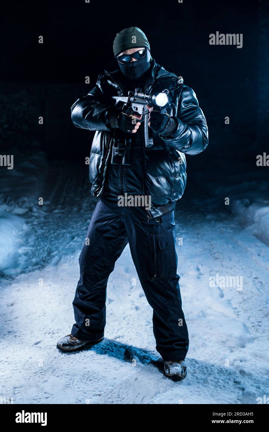 Strong man military special forces standing with gun at night Stock ...