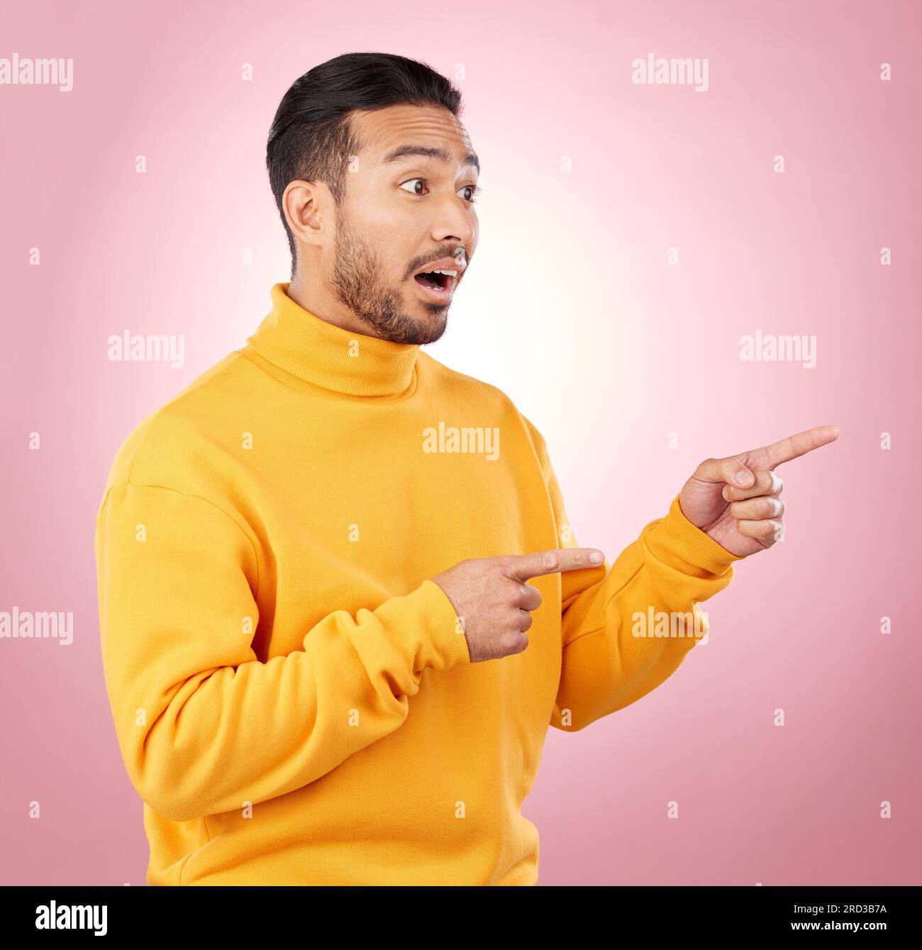 Surprise, pointing and wow with man and space in studio for show ...