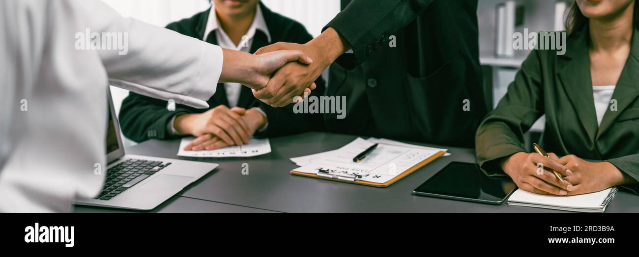 Interviewer handshaking the applicant hi-res stock photography and ...