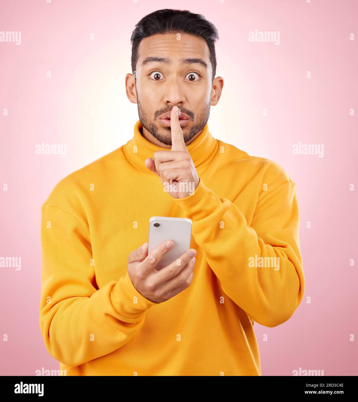 Man, phone and studio with finger, silence and sign language for secret ...