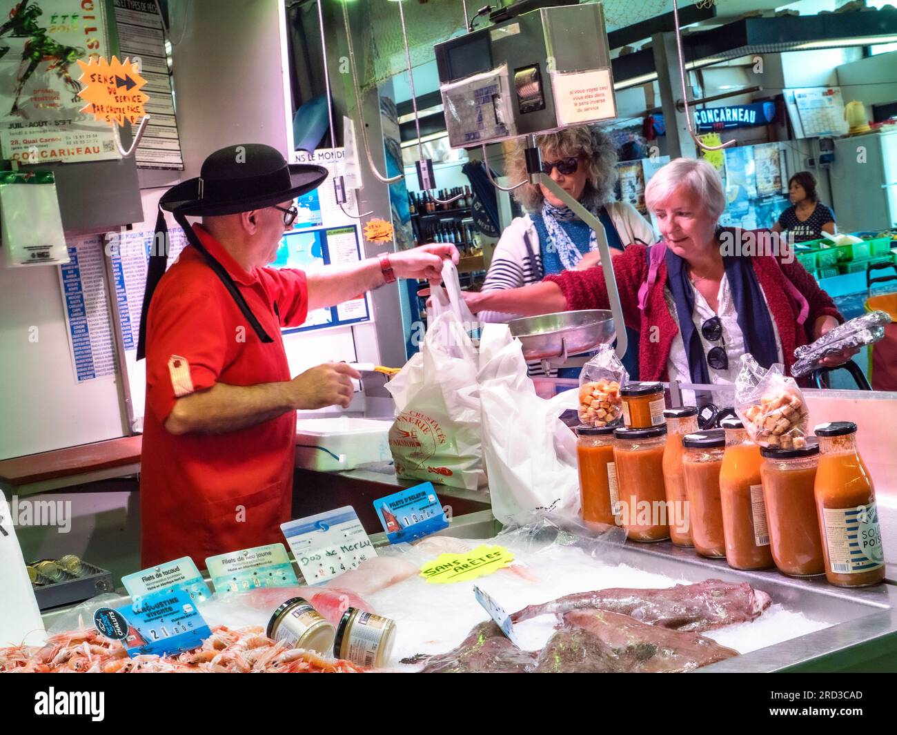 BRETON FISHMONGER SELLING FISH MARKET STALL BRITTANY CONCARNEAU HALLES ...