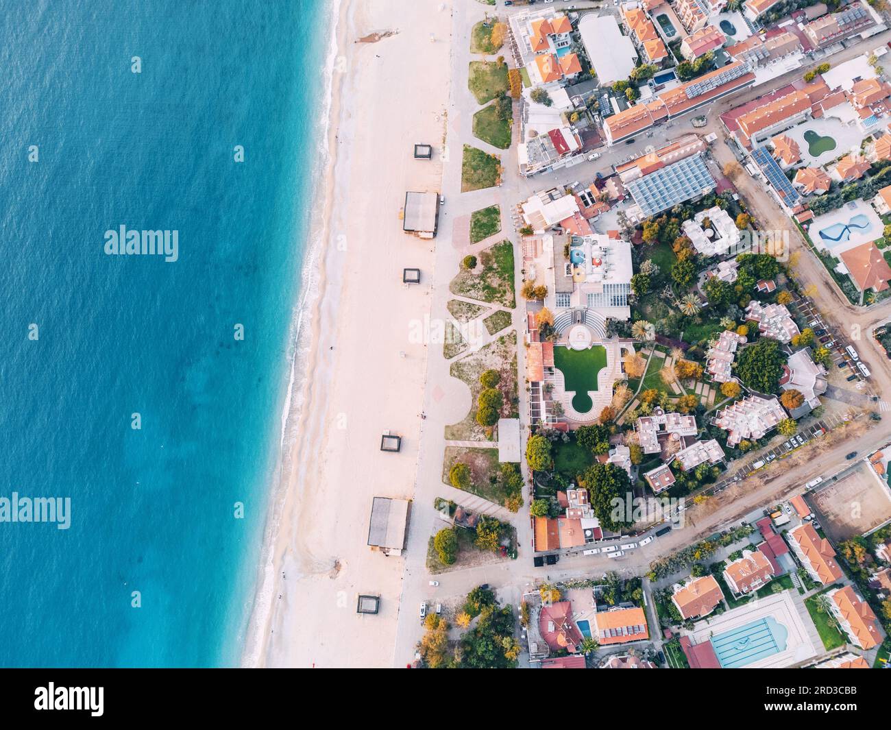 Aerial rooftop cityscape view of a resort old town and blue sea with ...