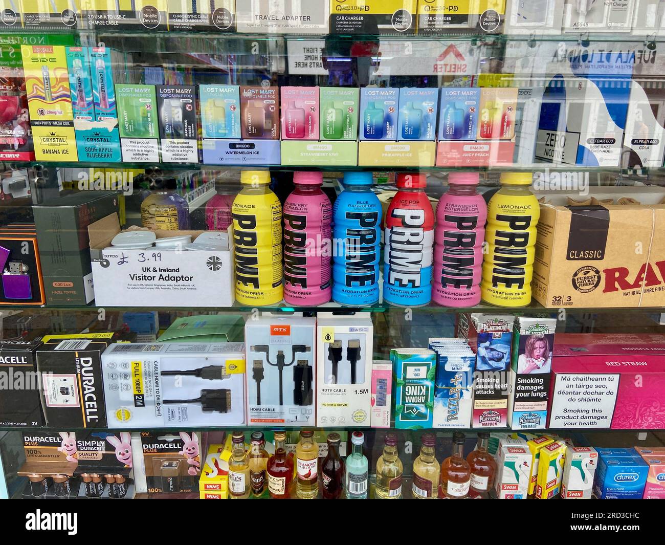 prime energy drinks disposable vapes on display in newsagent shop ...