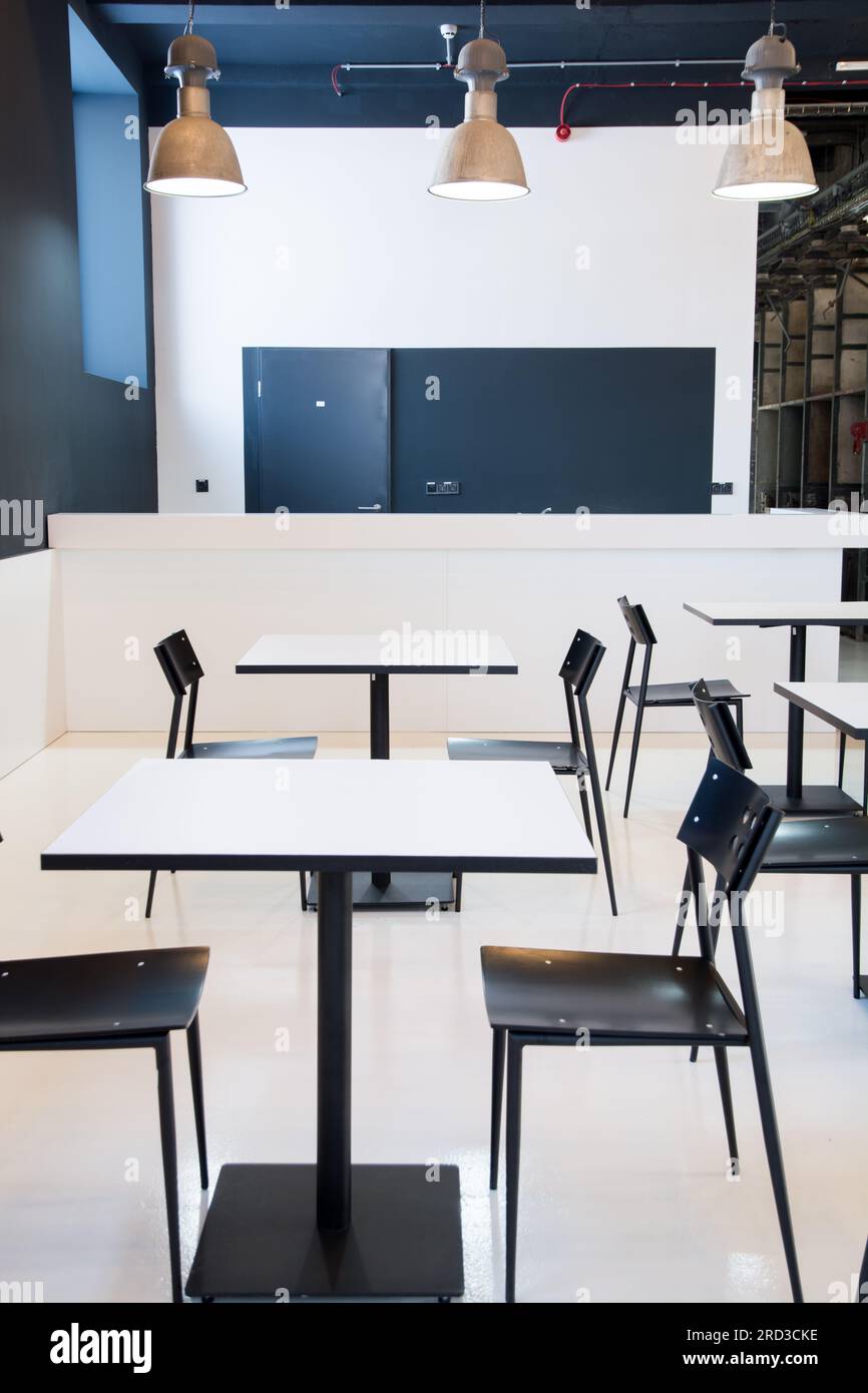 Modern and clean canteen, dining room. Empty tables Stock Photo - Alamy