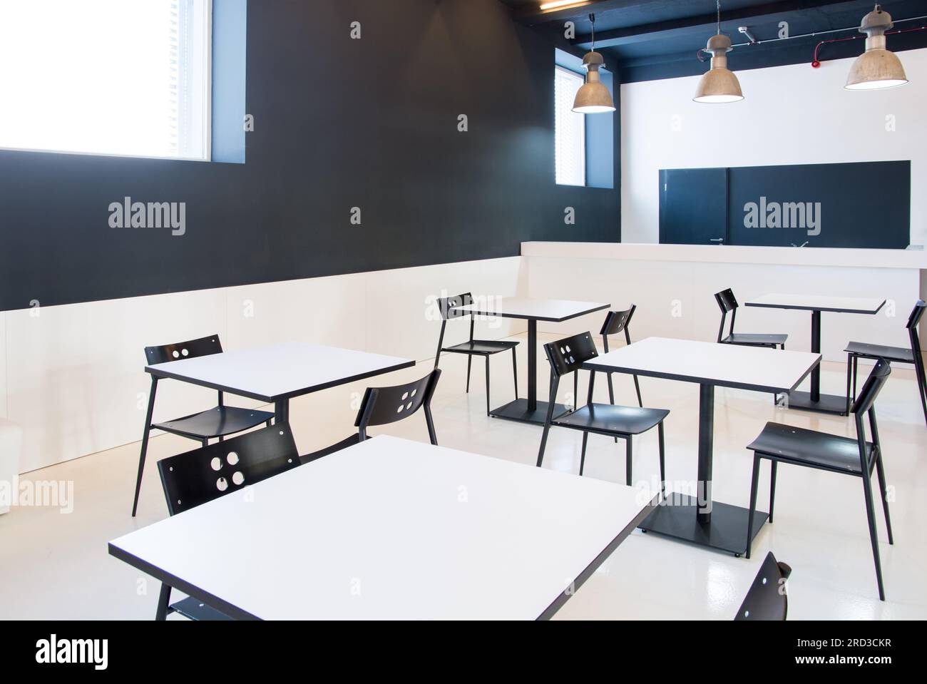 Modern and clean canteen, dining room. Empty tables Stock Photo - Alamy