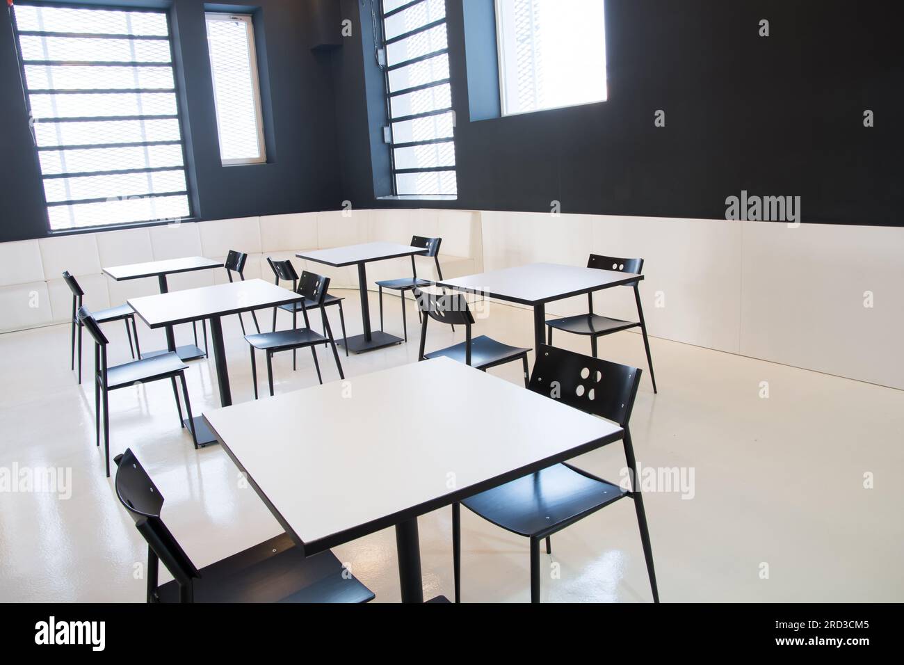 Modern and clean canteen, dining room. Empty tables Stock Photo - Alamy