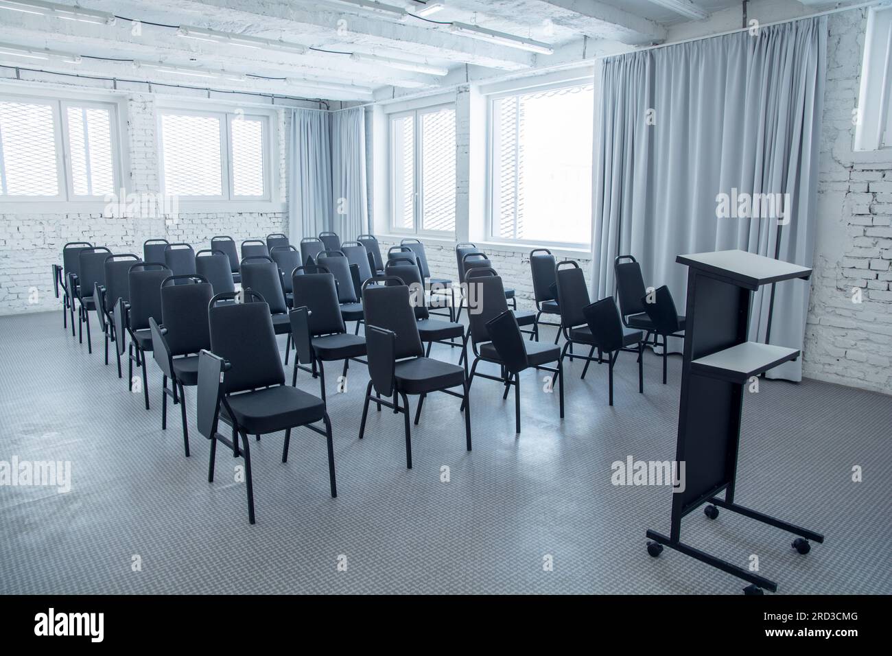 Clear conference room, classroom. White brick wall Stock Photo - Alamy