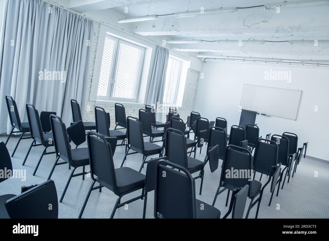 Clear conference room, classroom. White brick wall Stock Photo - Alamy