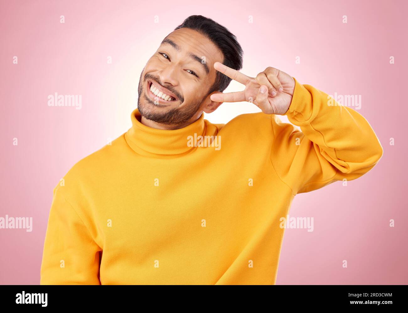 Smile, peace sign and portrait of man in studio for support, kindness ...