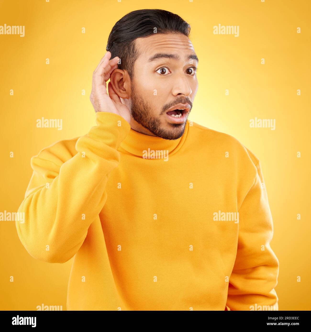 Asian man, listening and gossip with hand on ear in studio background ...