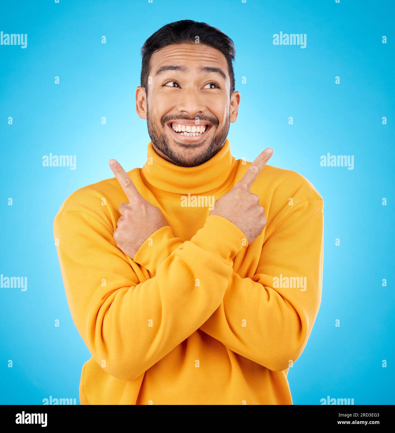 Happy, asian man and hands pointing in studio for choice, deal or sign ...
