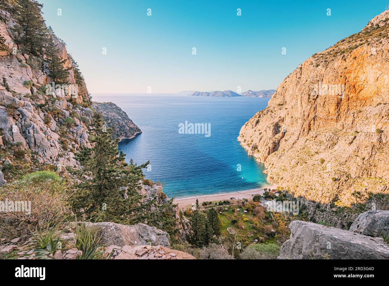 Butterfly valley verdant cliffs form a natural amphitheater, framing ...