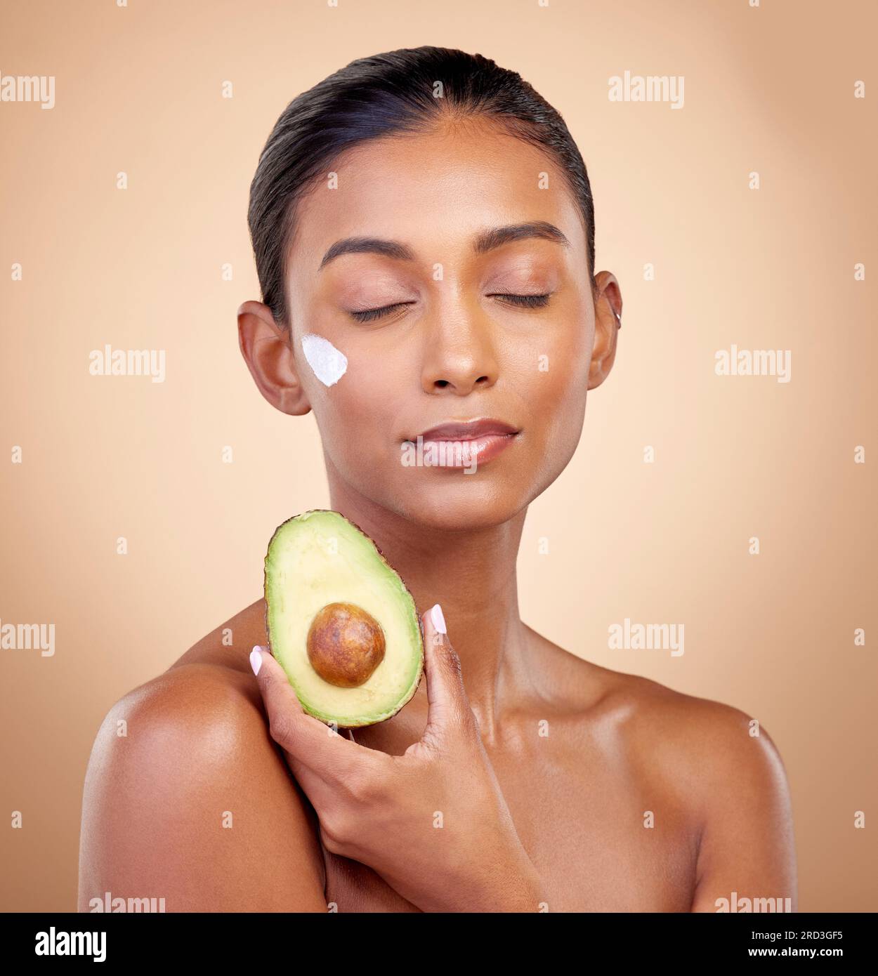 Avocado, cream and skincare with face of woman in studio for product ...