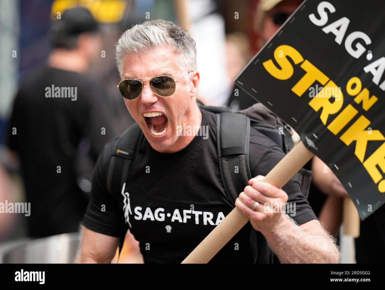 Actor Anson Mount carries a sign on a picket line outside Paramount in ...
