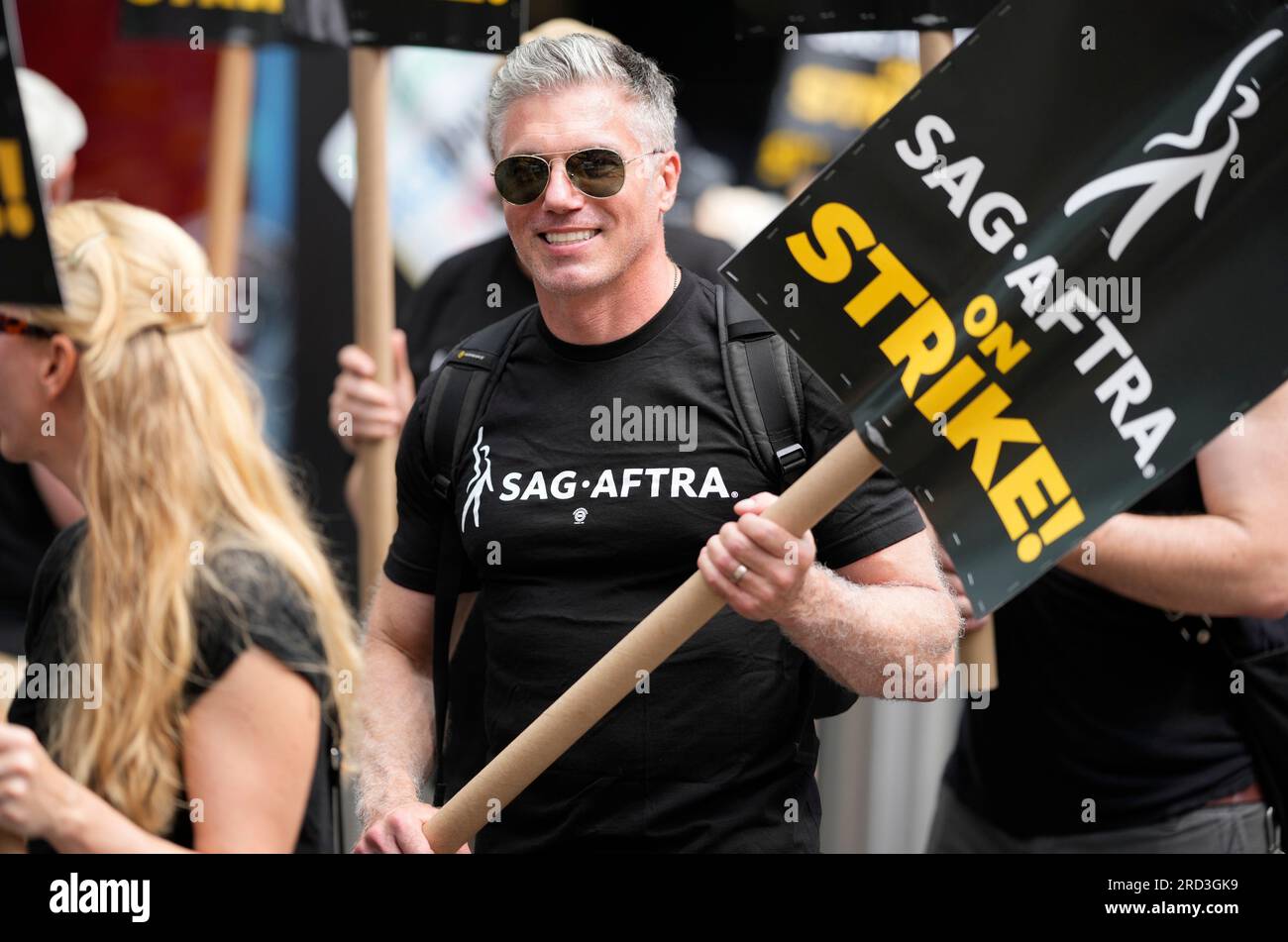 Actor Anson Mount carries a sign on a picket line outside Paramount in ...