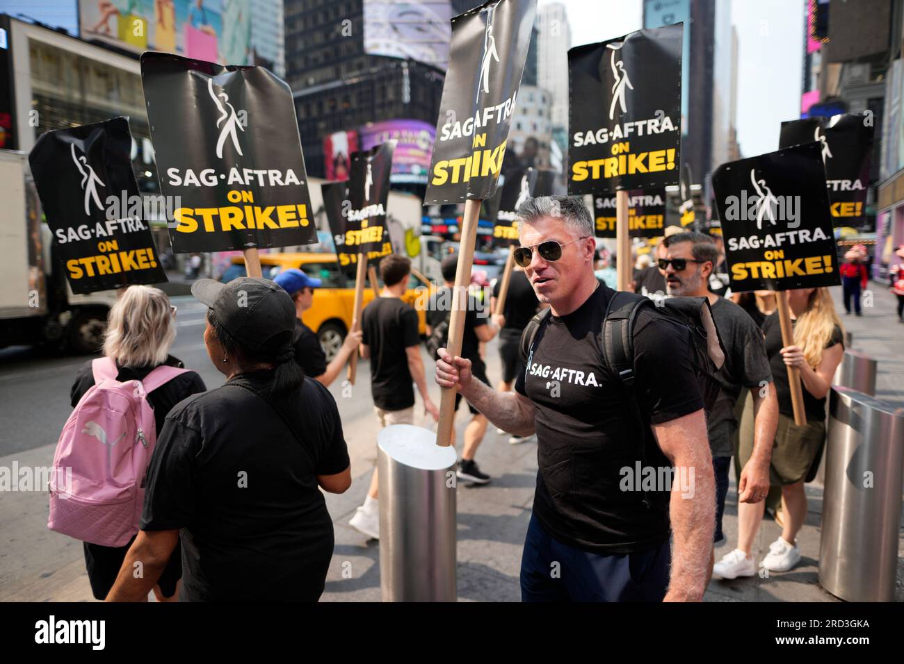 Actor Anson Mount carries a sign on a picket line outside Paramount in ...