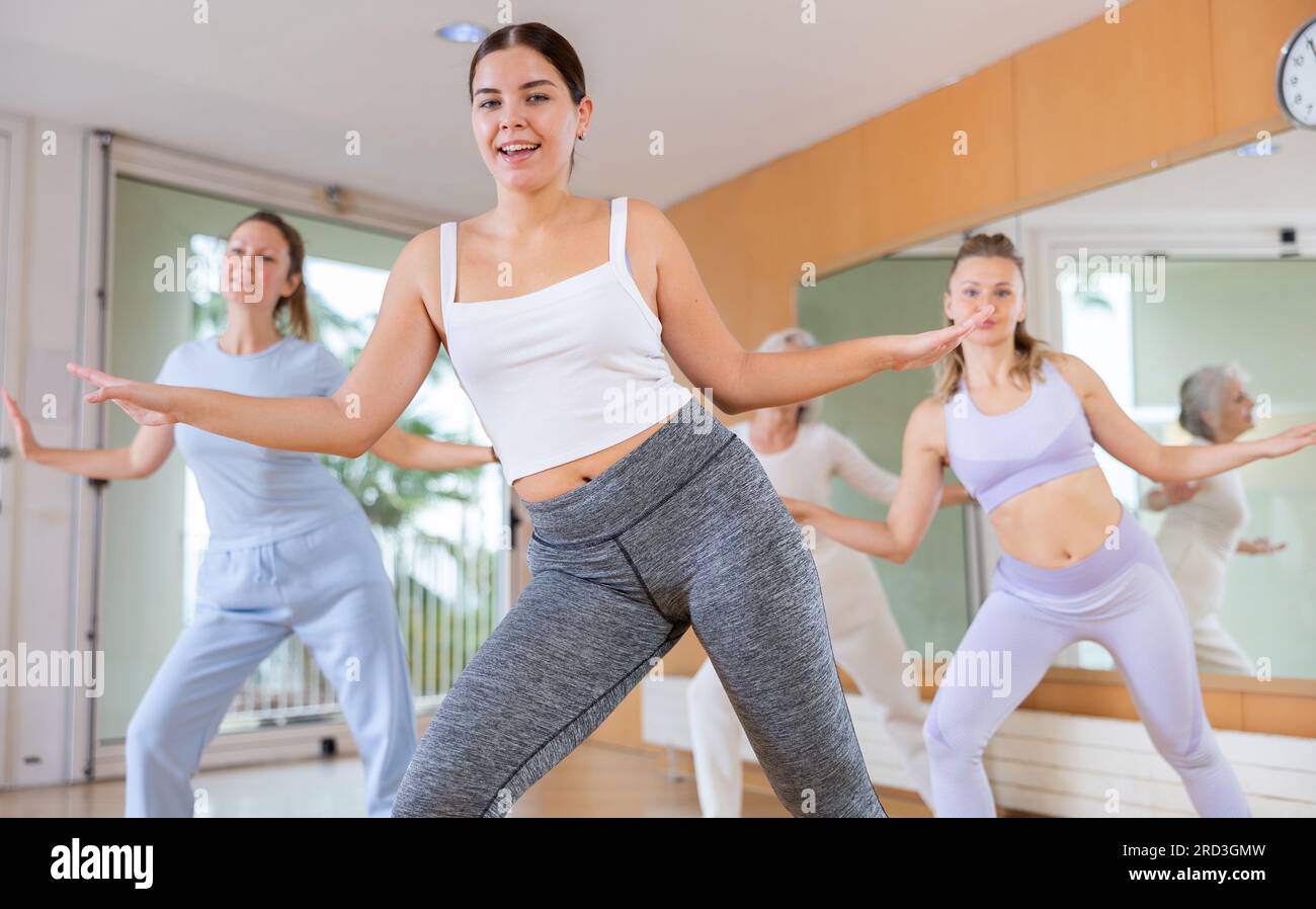Active people practicing lindy hop movements in dance class Stock Photo ...