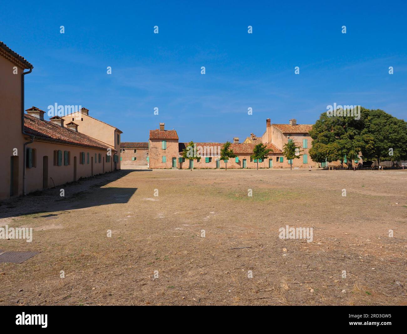 Small square surrounded by buildings Stock Photo - Alamy