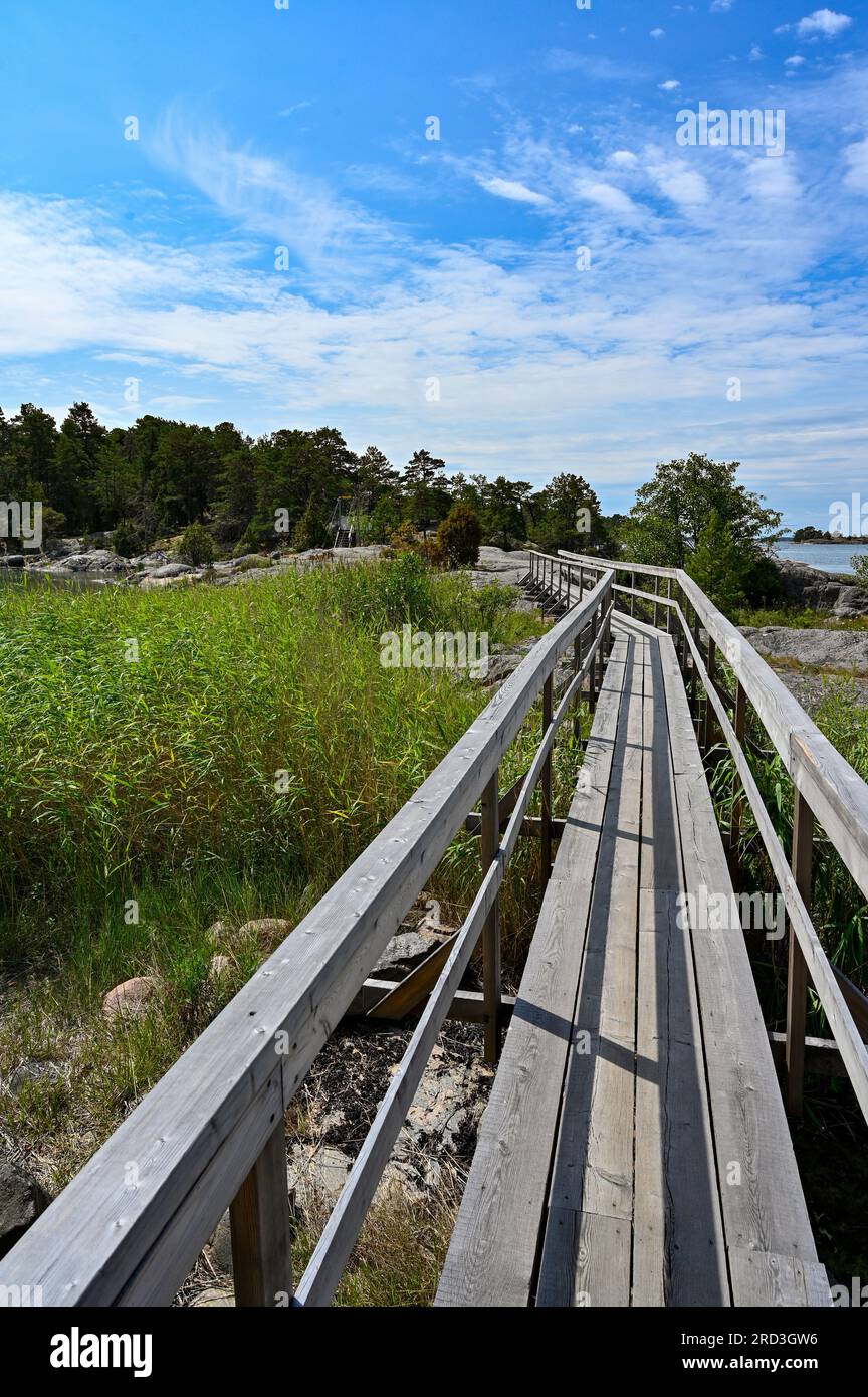 wooden foot bridge over water from to iland Stock Photo - Alamy
