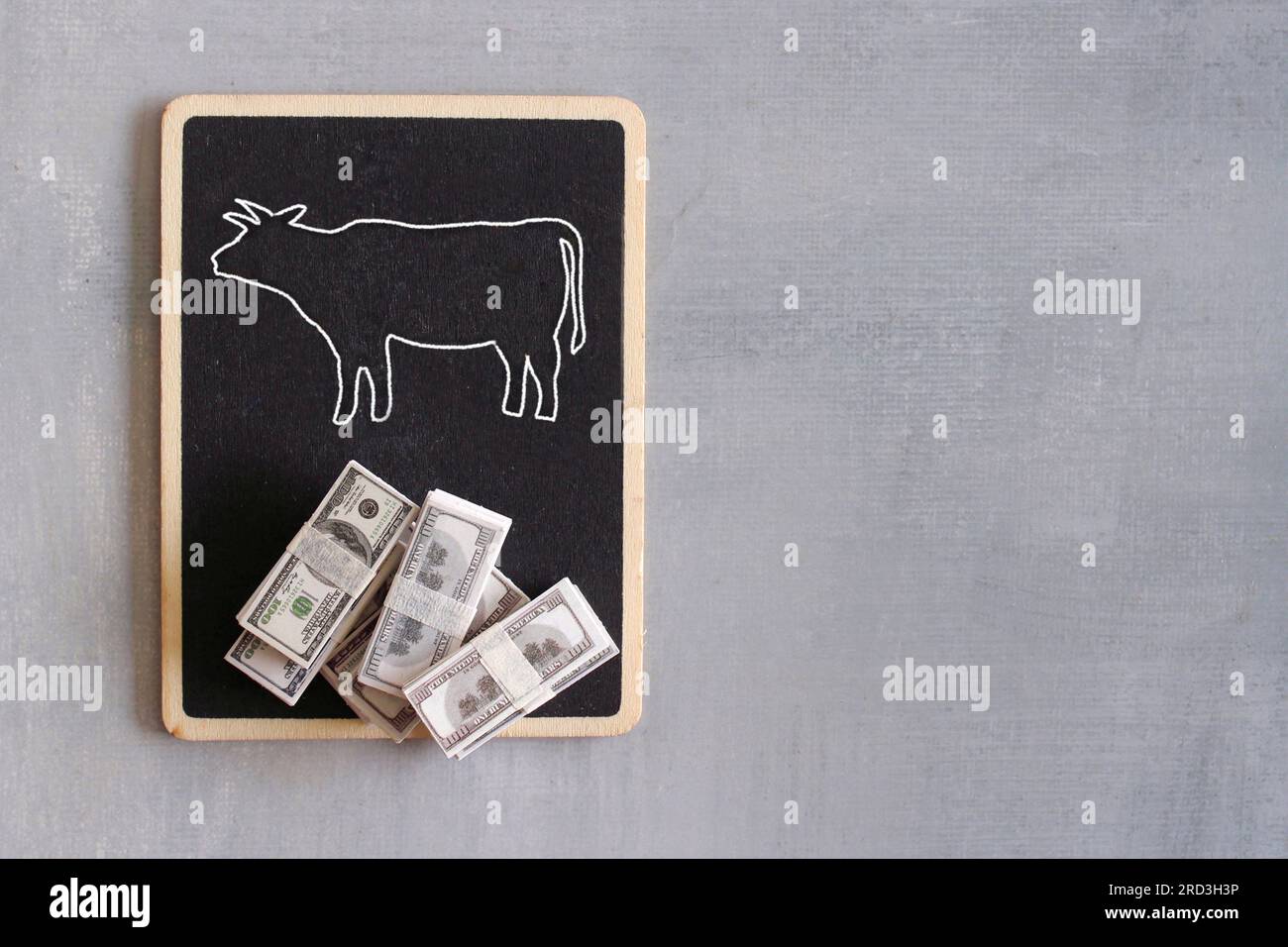 Drawing of cow and money with copy space. Business finance, cash cow ...