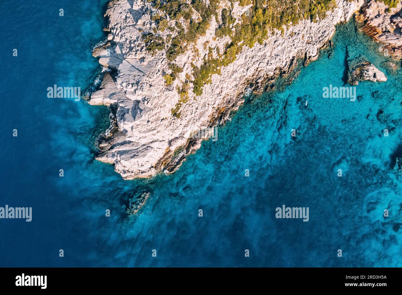 Rocky cliff aerial view. Azure sea or ocean coast. Summer resort and ...