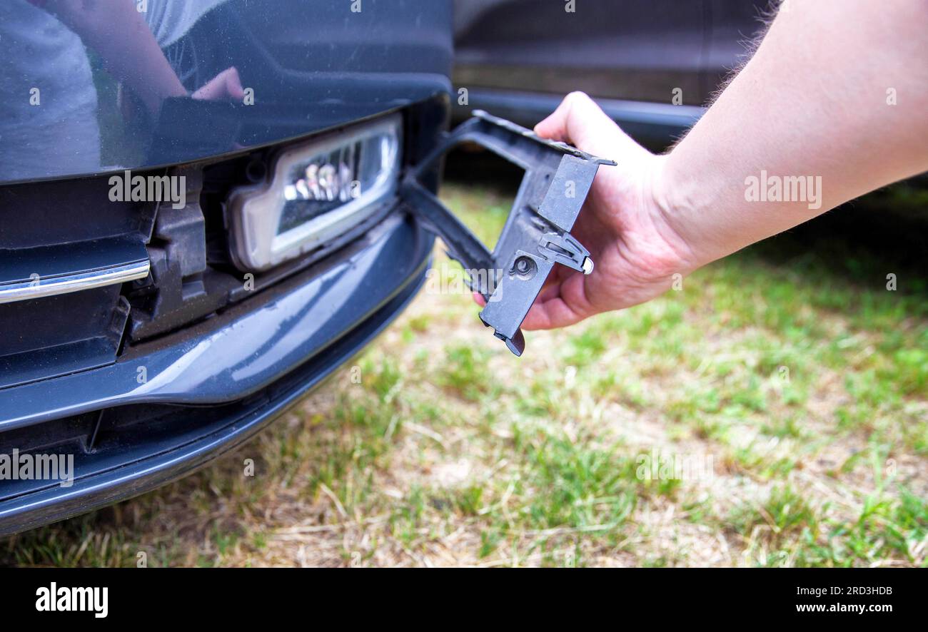 Disassembling and removing the fog lamp from a car to replace a burnt ...