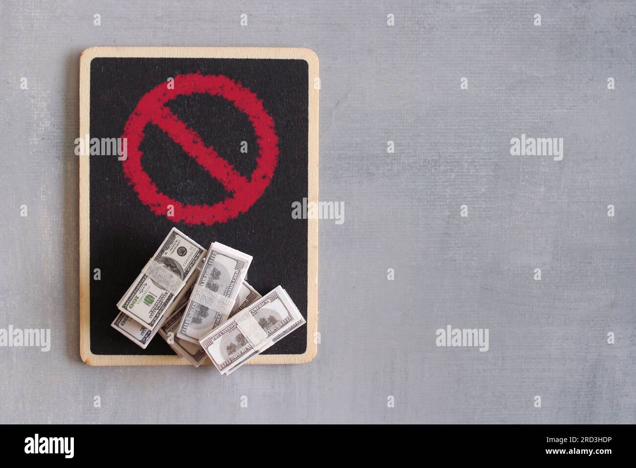 Stack of money and NO sign with copy space. Finance, no hidden fees, no ...