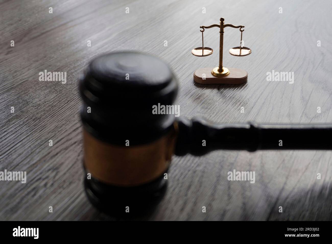Close up image of judge gavel and scale on table. Symbol of law and ...